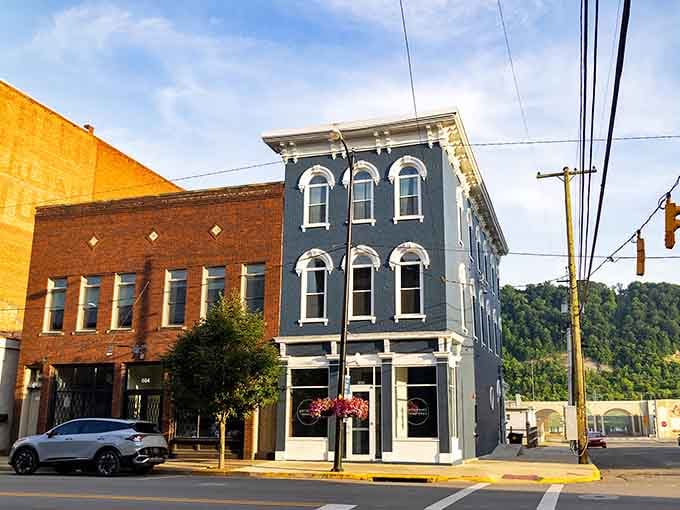 That blue corner building catches the golden hour light like it's posing for its best angle.