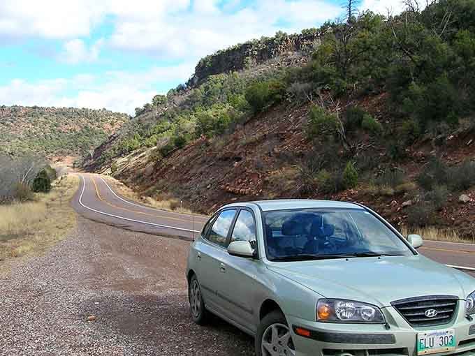 Serpentine curves descending through layered canyon walls make you grateful someone invented power steering and good brakes.