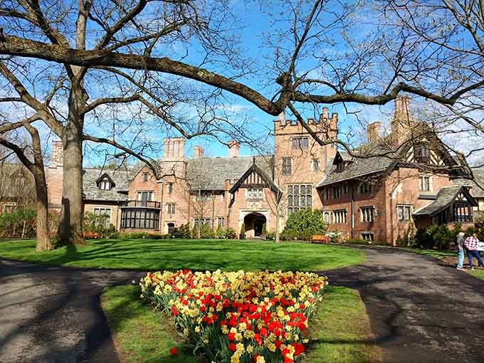 Stan Hywet's Tudor mansion rises majestically behind spring tulips that would make any English garden jealous with envy.