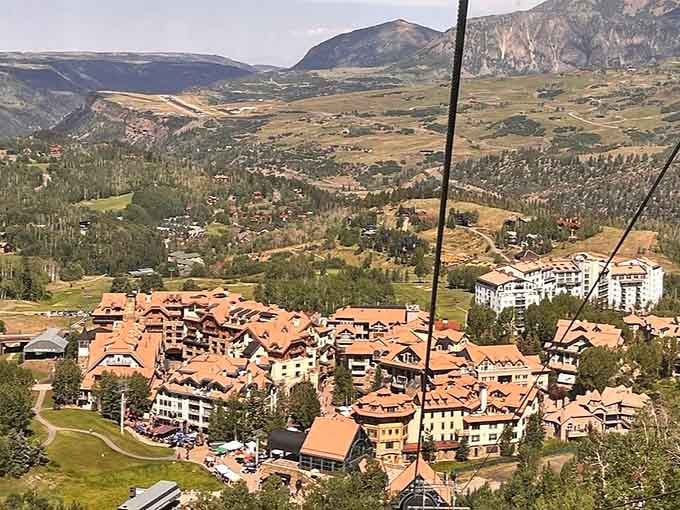 The gondola cables stretch across the valley, offering bird's-eye views of Mountain Village nestled among peaks like a Swiss postcard.