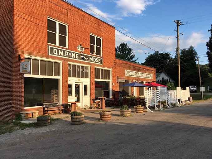The vintage Q.M. Pyne signage on warm brick catches the late afternoon sun like liquid gold.