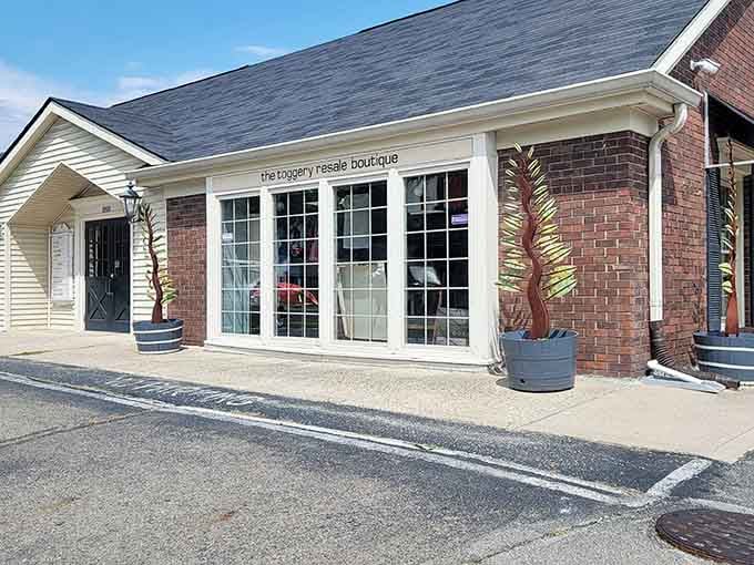 The charming boutique exterior with decorative planters promises a more curated shopping experience than your typical thrift store adventure.