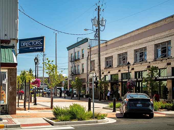 Colorful trees and brick sidewalks create an inviting atmosphere for leisurely downtown strolls.