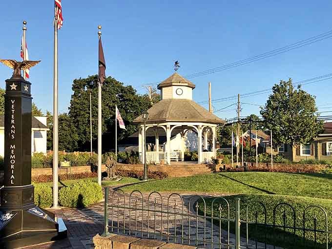 The Veterans Memorial stands proudly beside a classic gazebo, honoring those who served with quiet dignity and grace.