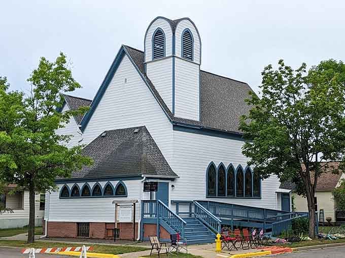 White clapboard and Gothic windows create a charming church that looks like it stepped straight from a Currier and Ives print.
