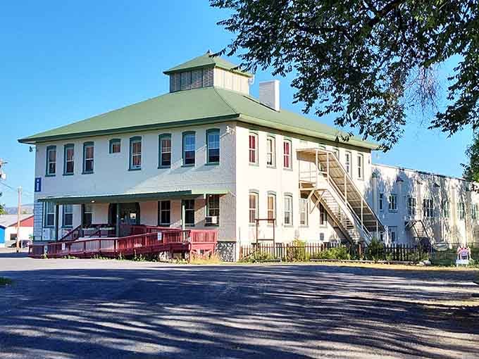 The historic building with its distinctive cupola stands proudly as a reminder of the community's educational heritage and values.