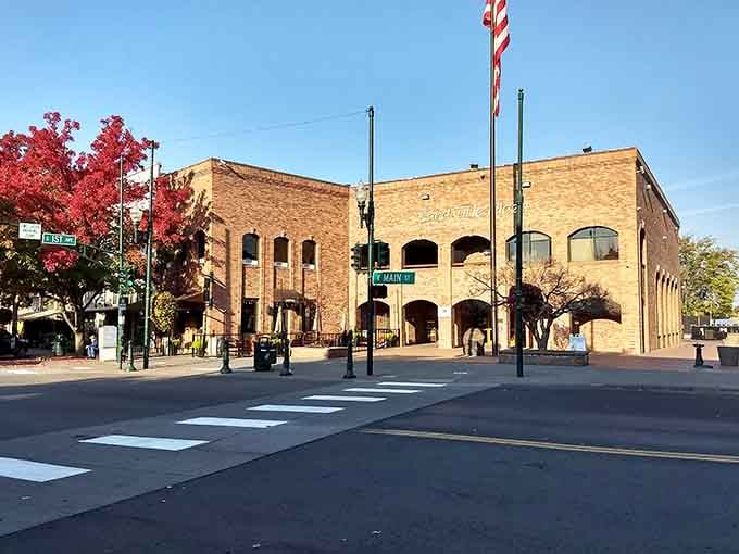 Wide crosswalks and sturdy brick buildings create a downtown that remembers when people actually walked places and meant it.