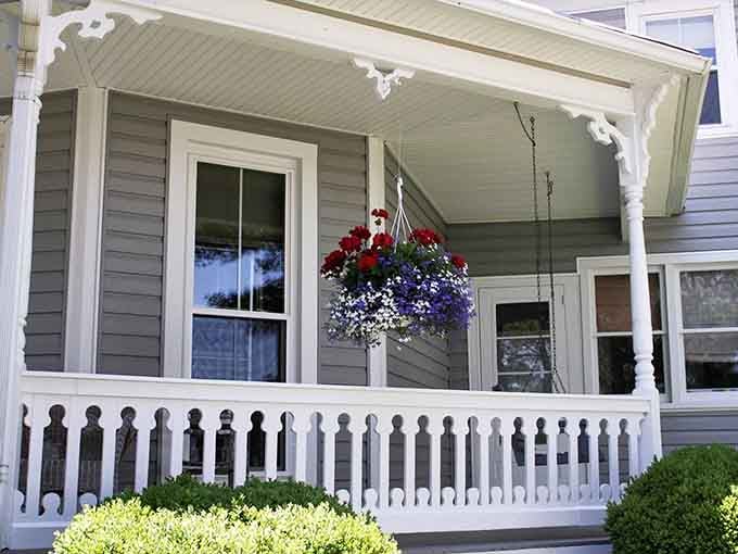 That charming front porch with patriotic blooms welcomes you like visiting your sweetest neighbor's house.