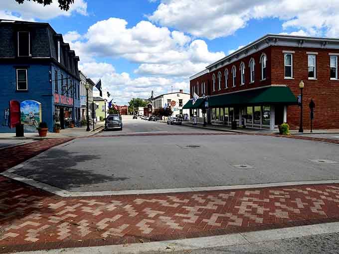 The brick-paved intersection creates a town center that feels designed for community, not just cars passing through.