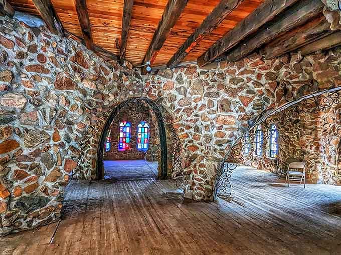 The handcrafted stone archways and wooden beams reveal the painstaking work of decades spent building an impossible dream castle.