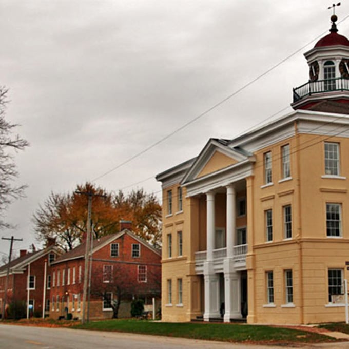 That golden courthouse with its red-topped cupola stands proud like it's been posing for photographs since before cameras existed.