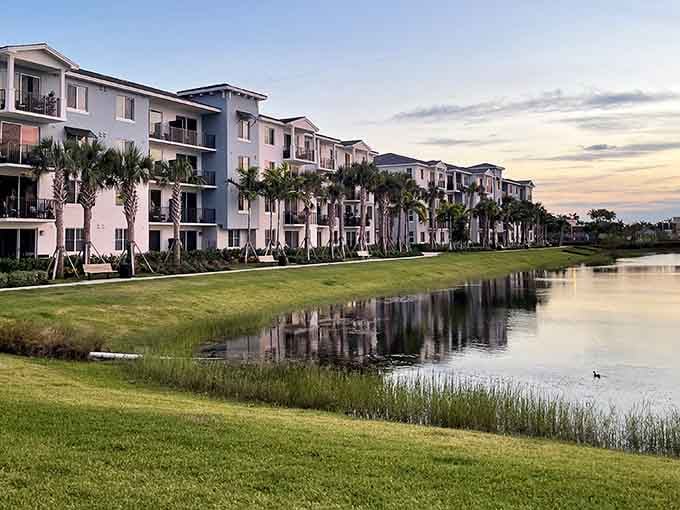 Modern communities nestle beside tranquil waters where herons fish and residents enjoy front-row seats to nature's daily show.