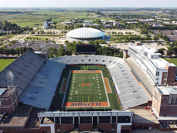 This aerial view captures a college stadium that fills with roaring fans on autumn Saturdays like clockwork.