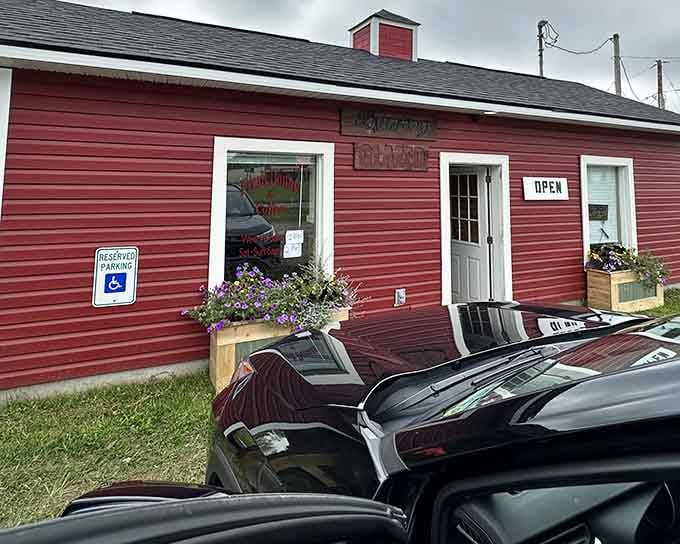 Flower boxes and an "OPEN" sign on this charming red building promise homemade goodness that's worth every single mile.