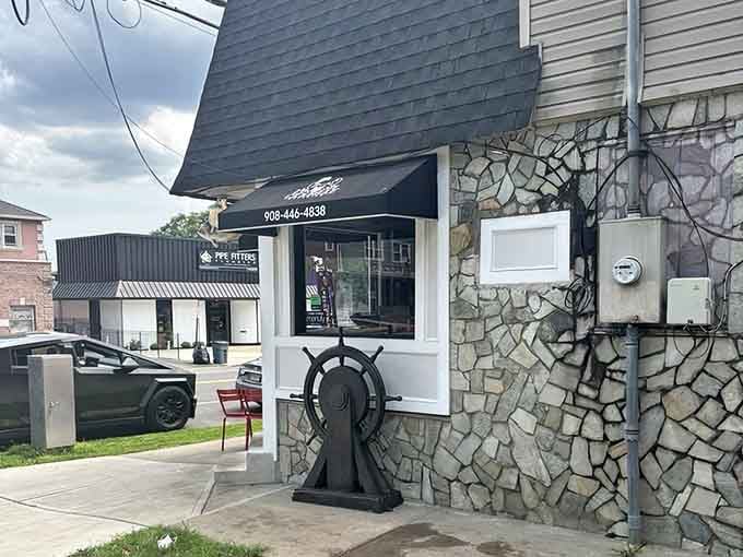 The ship's wheel decoration on that distinctive stone wall steers hungry diners toward messy, delicious, utterly satisfying seafood feasts.