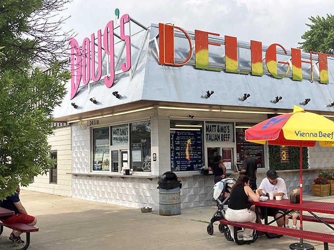Sunny afternoon light hits those colorful letters just right, making this classic stand glow like a beacon of joy.