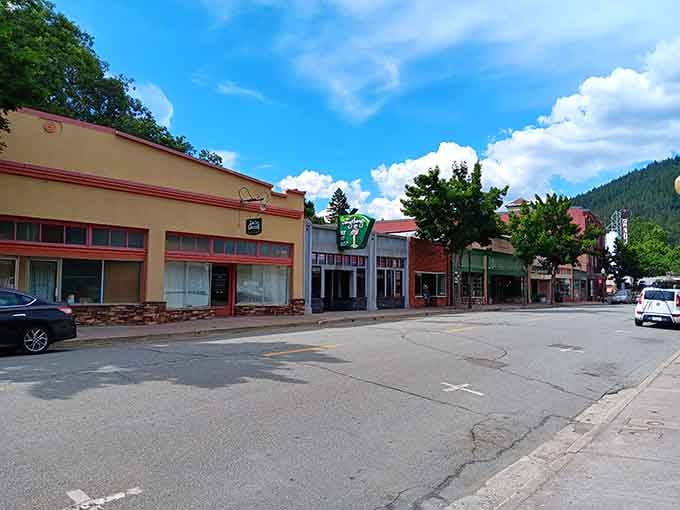 Mountains embrace this main street where the biggest traffic jam involves maybe three cars waiting patiently.