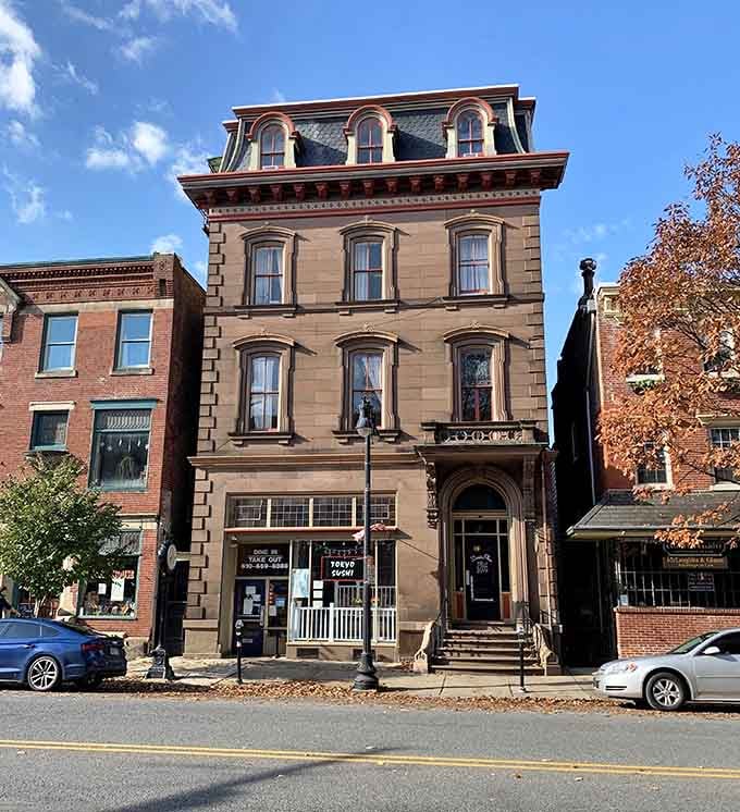 This brownstone beauty stands tall and dignified, like the distinguished gentleman of the block in his Sunday best attire.