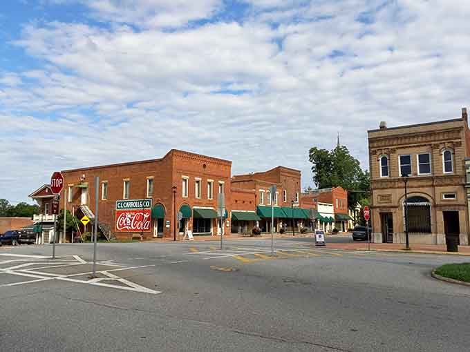 Explore the historic charm of downtown Eatonton, Georgia, where classic brick storefronts and vintage signs create a warm, welcoming atmosphere.