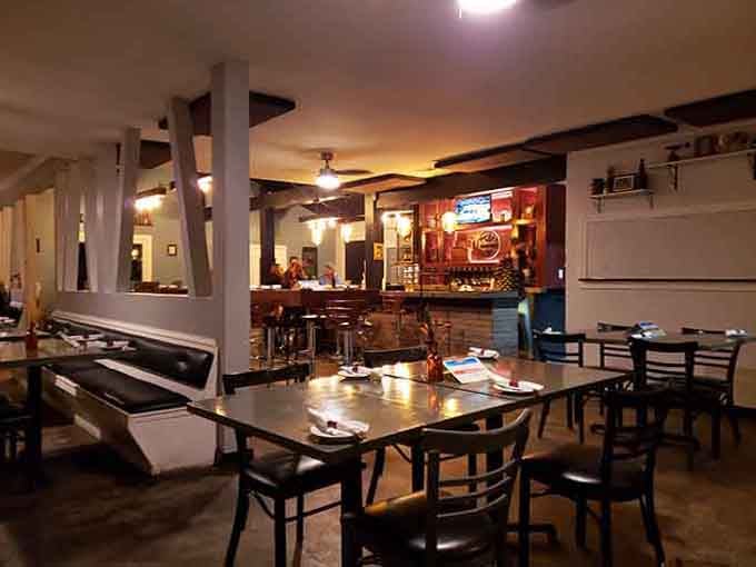 Inside, the warm lighting and comfortable seating arrangements make every guest feel like part of the family dining room.