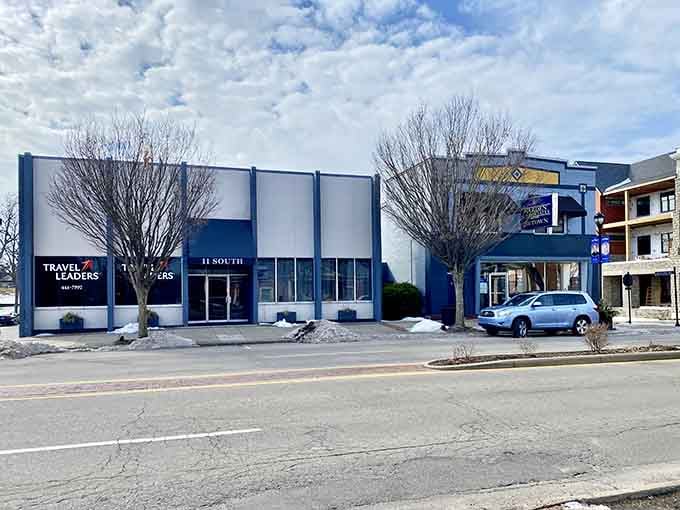 That blue-and-white storefront stands proud like a beacon for travelers who still appreciate the art of the personal touch.
