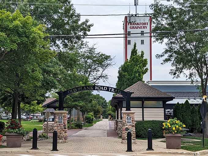 The grain elevator towers over Old Plank Road Trail's entrance like a lighthouse guiding visitors to small-town treasures.