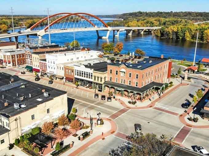 From above, this riverside town reveals its secret: where historic brick meets sparkling water, something wonderful happens every time.