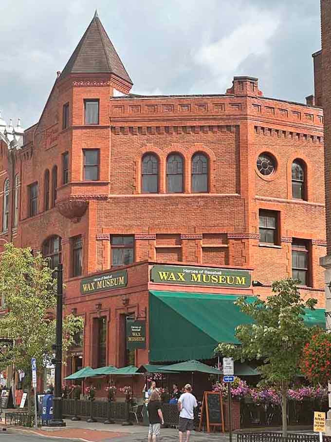 The ornate turret and arched windows create a Victorian backdrop perfect for celebrating America's pastime through lifelike wax figures.