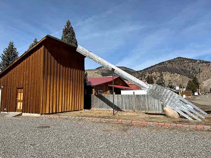The giant fork stands proud against mountain peaks, reminding us that art doesn't always need deep meaning.