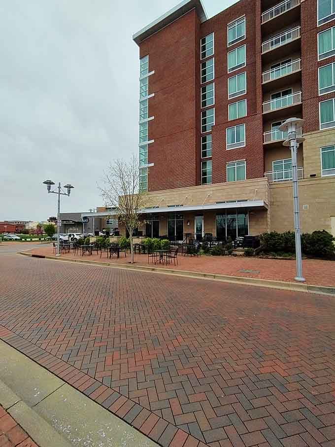 The outdoor seating area beckons on pleasant days, perfect for savoring seafood while watching downtown Owensboro come alive.