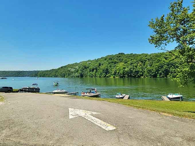 The boat launch and rolling hills beyond remind you that adventure's always just a paddle stroke away.