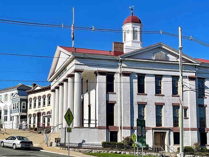 That red-domed courthouse stands proud, anchoring a town square where good food and good company have gathered for generations.