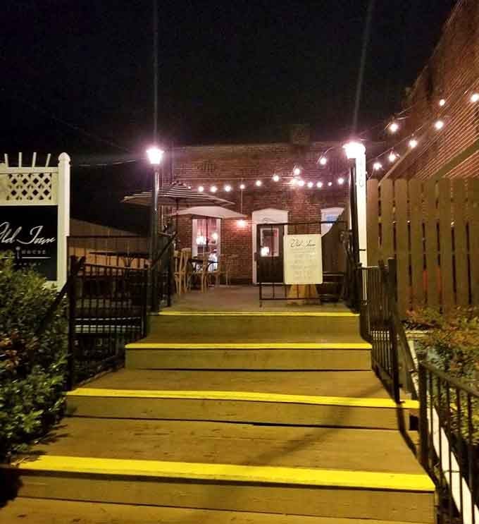 Those glowing bistro lights strung overhead create the perfect ambiance for savoring a perfectly cooked ribeye.