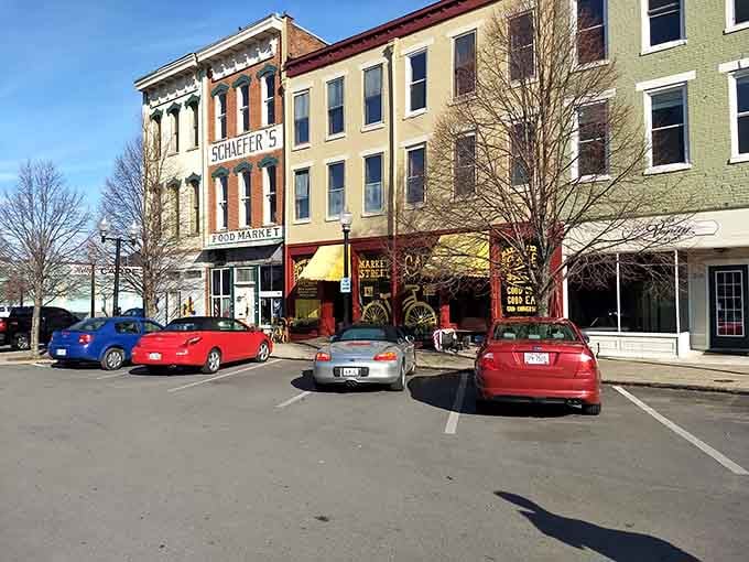 Sunny day in Portsmouth showcases charming storefronts, parked cars, and a welcoming small town vibe perfect for strolling and exploring.