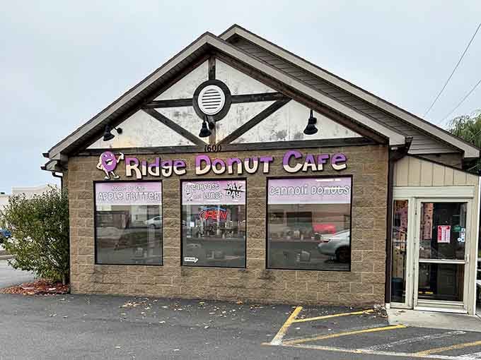 The peaked roof and stone facade give this neighborhood spot a welcoming, almost cottage-like charm and warmth.