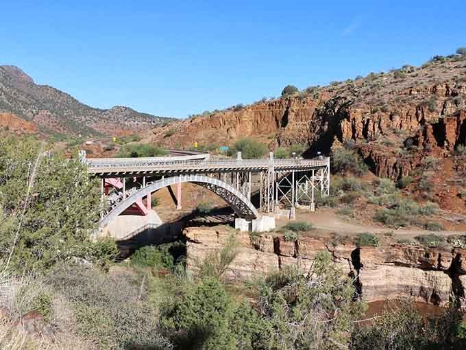 This graceful steel arch bridge stands as a testament to Depression-era craftsmanship against a backdrop of timeless geological beauty.