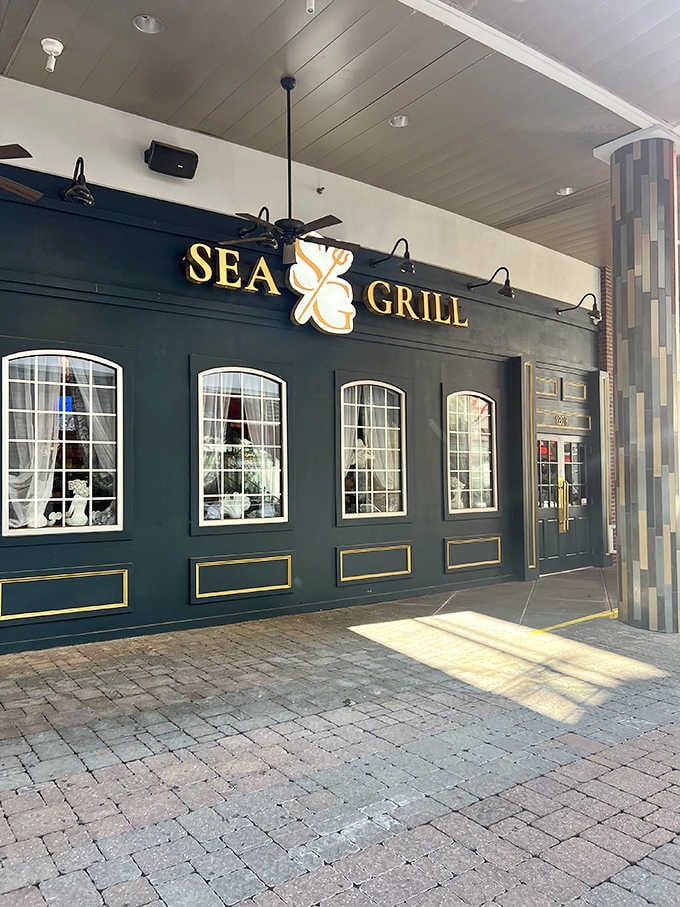 The glowing sign and classic storefront design welcome diners seeking ocean flavors far from the actual coast.