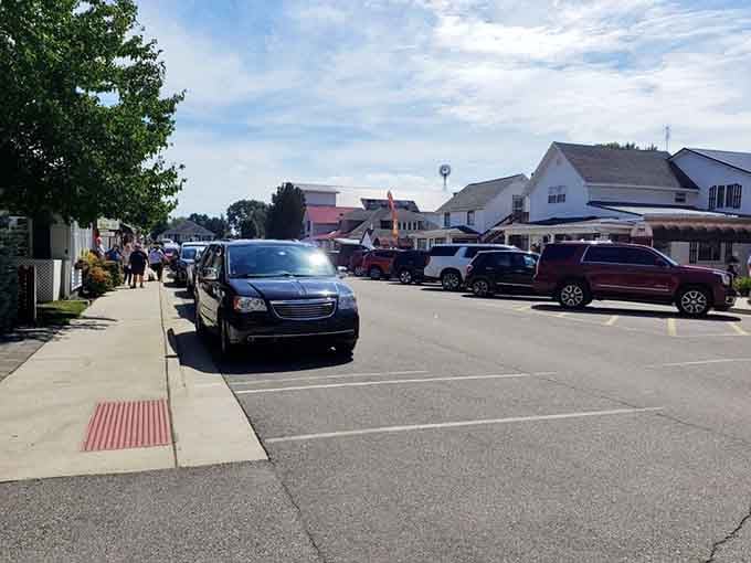 Modern vehicles parked along timeless streets show how past and present can coexist quite beautifully together.