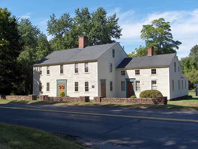 History comes alive in this quaint, well-preserved home, showcasing the timeless architectural beauty found throughout charming Simsbury, Connecticut area landscapes.