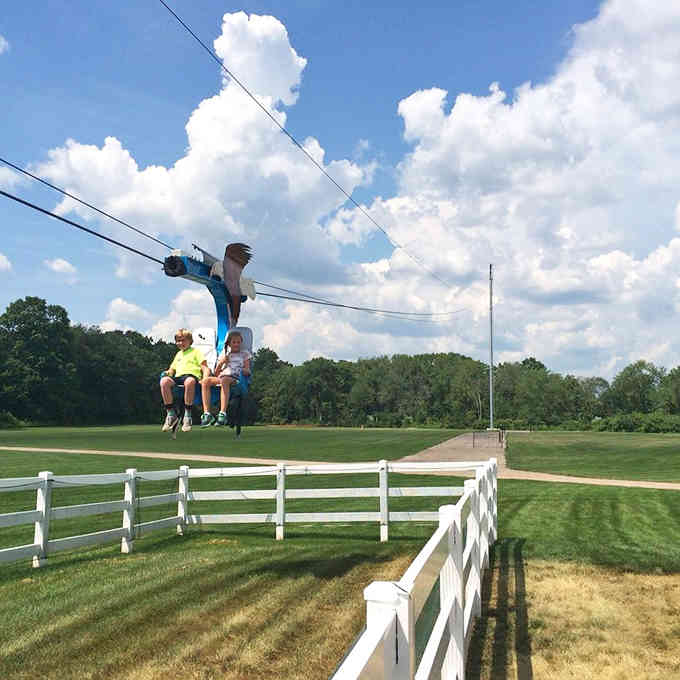 Soaring high above white fences, the zip line promises an adrenaline rush that'll make your inner child absolutely giddy.