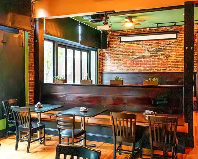 Exposed brick walls and contemporary design elements blend beautifully, creating an inviting space where quality ingredients meet skilled preparation and care.