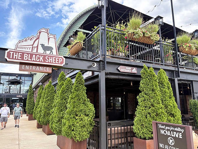 The entrance sign and lush greenery frame a destination where exceptional steaks meet genuine hospitality every night.