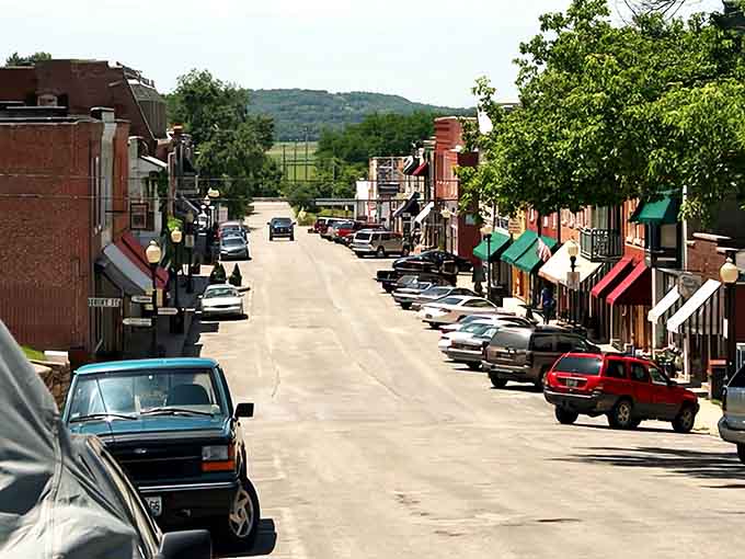 Colorful awnings and brick facades frame a street where the hills beyond promise wine country adventures just minutes away.