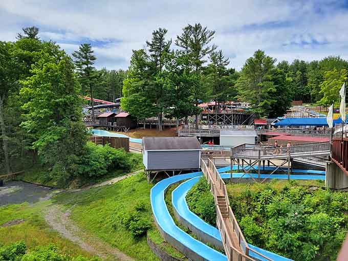 Winding blue flumes snake through the forest like a kid's dream come true&mdash;classic water park fun nestled in the green Catskill woods.