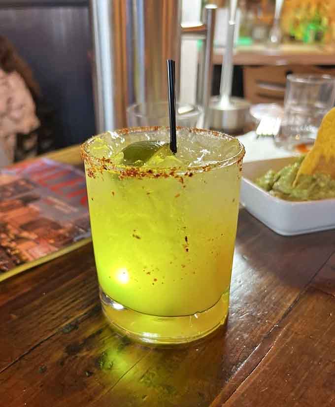 That glowing margarita with its spicy rim looks like liquid sunshine in a glass, pure happiness.
