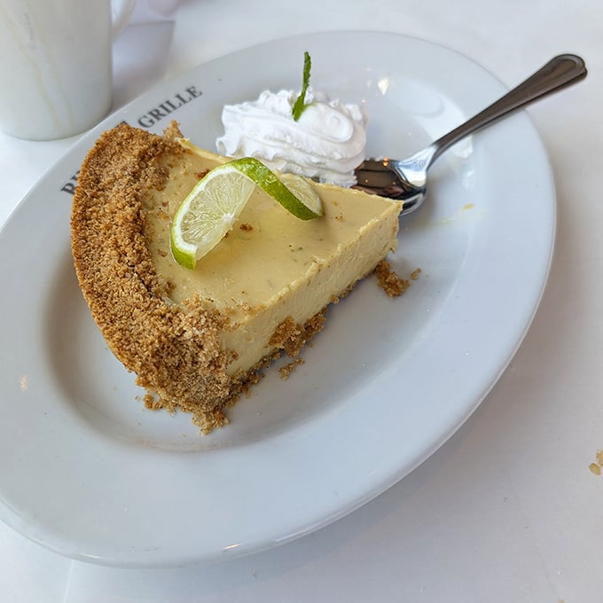 Key lime pie delivers that perfect sweet-tart balance, making dessert stomach space suddenly appear out of nowhere.