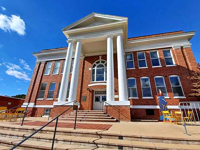 Those grand white columns rising against blue sky prove culture and architecture belong everywhere, not just cities.