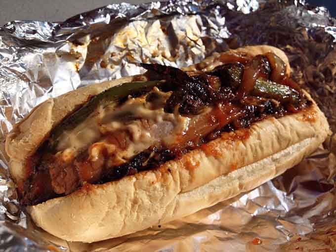 A brisket sandwich wrapped in foil like a delicious present you get to unwrap and devour.