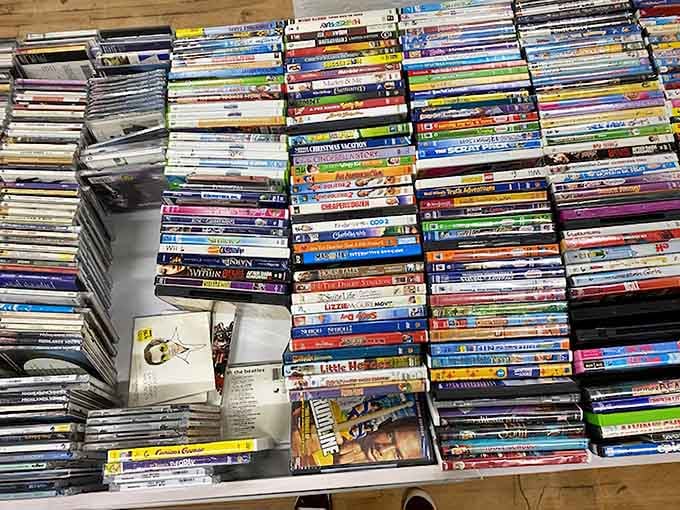 DVDs stacked like treasure waiting to be rediscovered by anyone who still owns a working player.