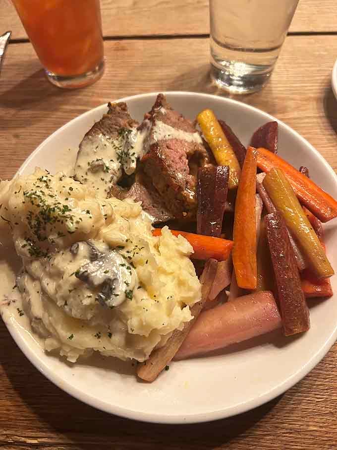 Pot roast with mashed potatoes and roasted carrots delivers comfort food that would make your grandmother jealous.